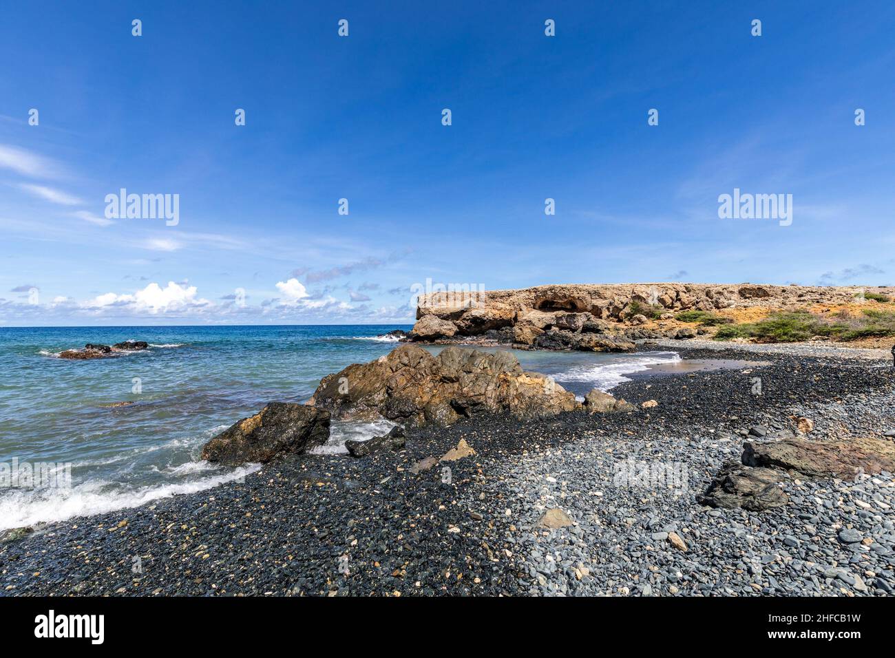Rocky cliff where people cave dive Aruba Stock Photo - Alamy