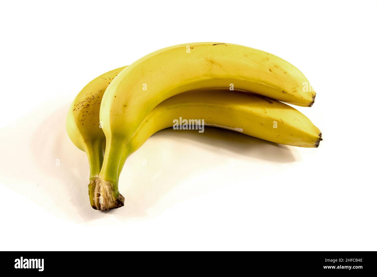 Three bananas isolated on white Stock Photo - Alamy