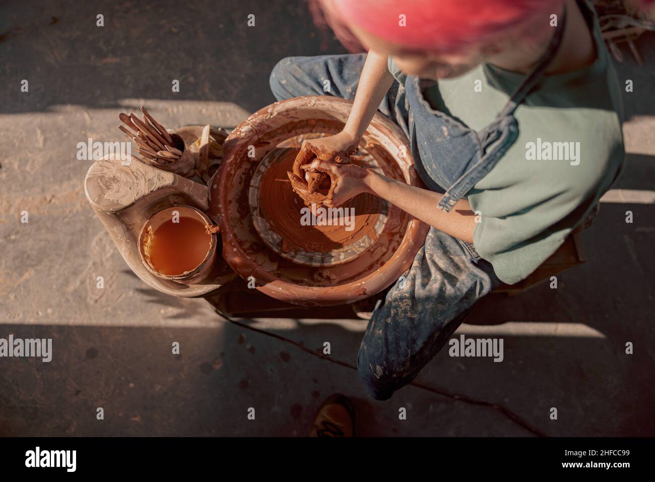 Woman working raw clay hi-res stock photography and images - Alamy