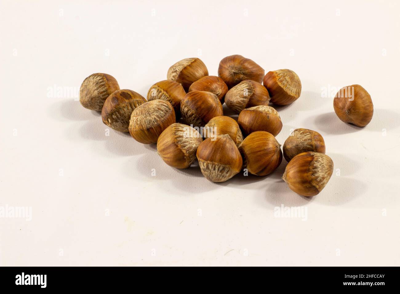 Bunch of hazelnuts isolated on white Stock Photo - Alamy