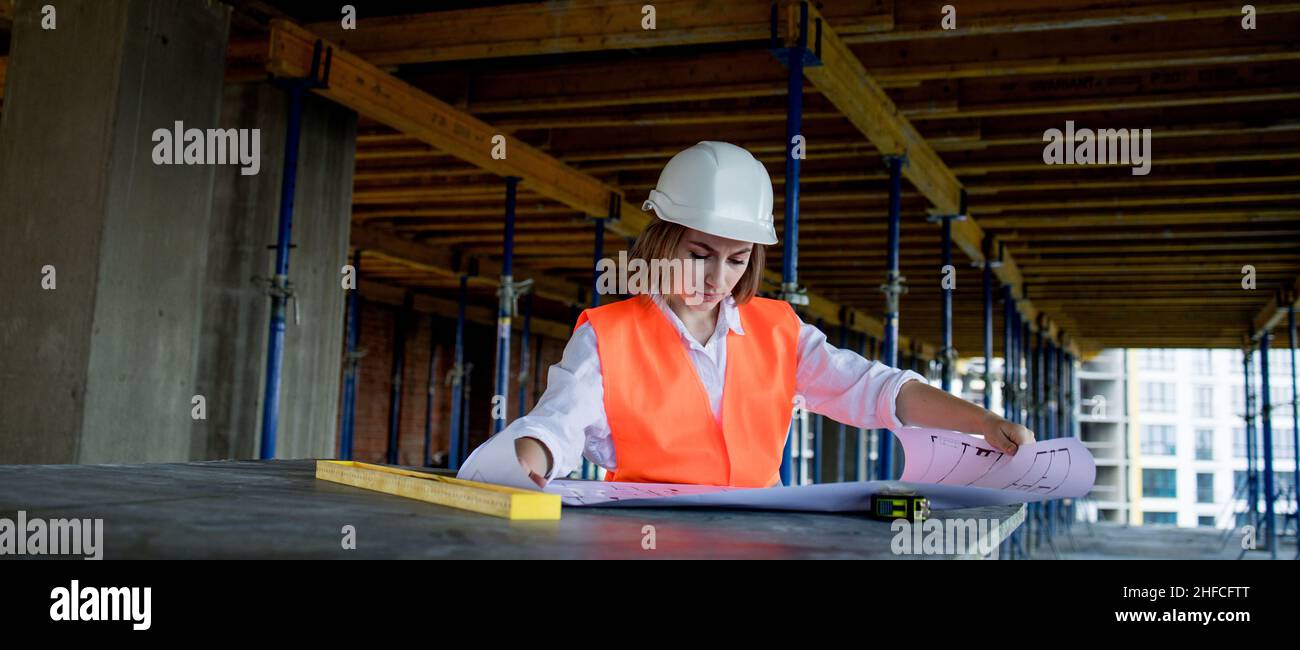 Architect or engineer working, browsing building project indoor of ...