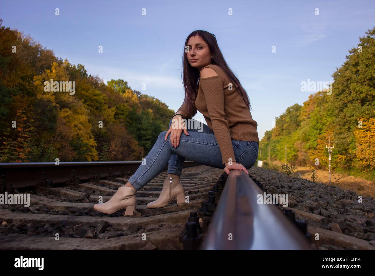 beautiful girl on the railway track Stock Photo - Alamy