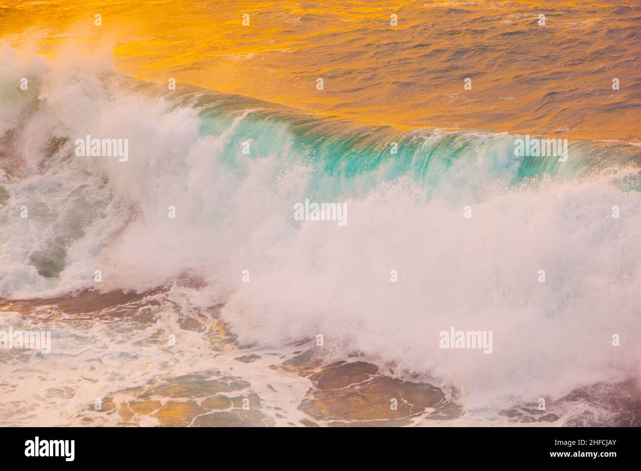 beautiful waves at the beach in sunset Stock Photo - Alamy