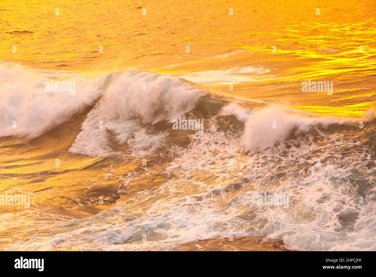 beautiful waves at the beach in sunset Stock Photo - Alamy