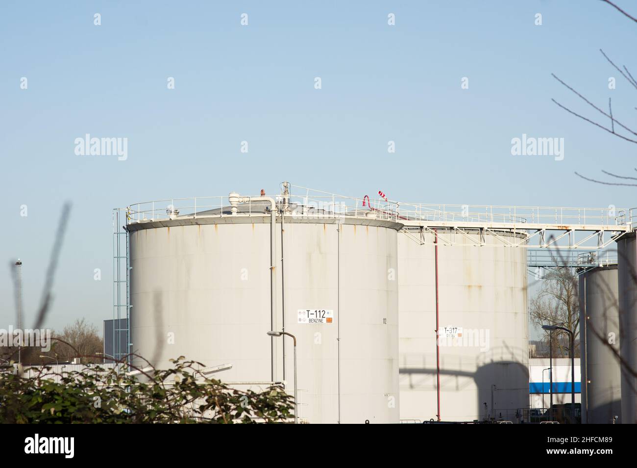 Large grey industrial tanks for petrol and oil storage in Arnhem in the ...
