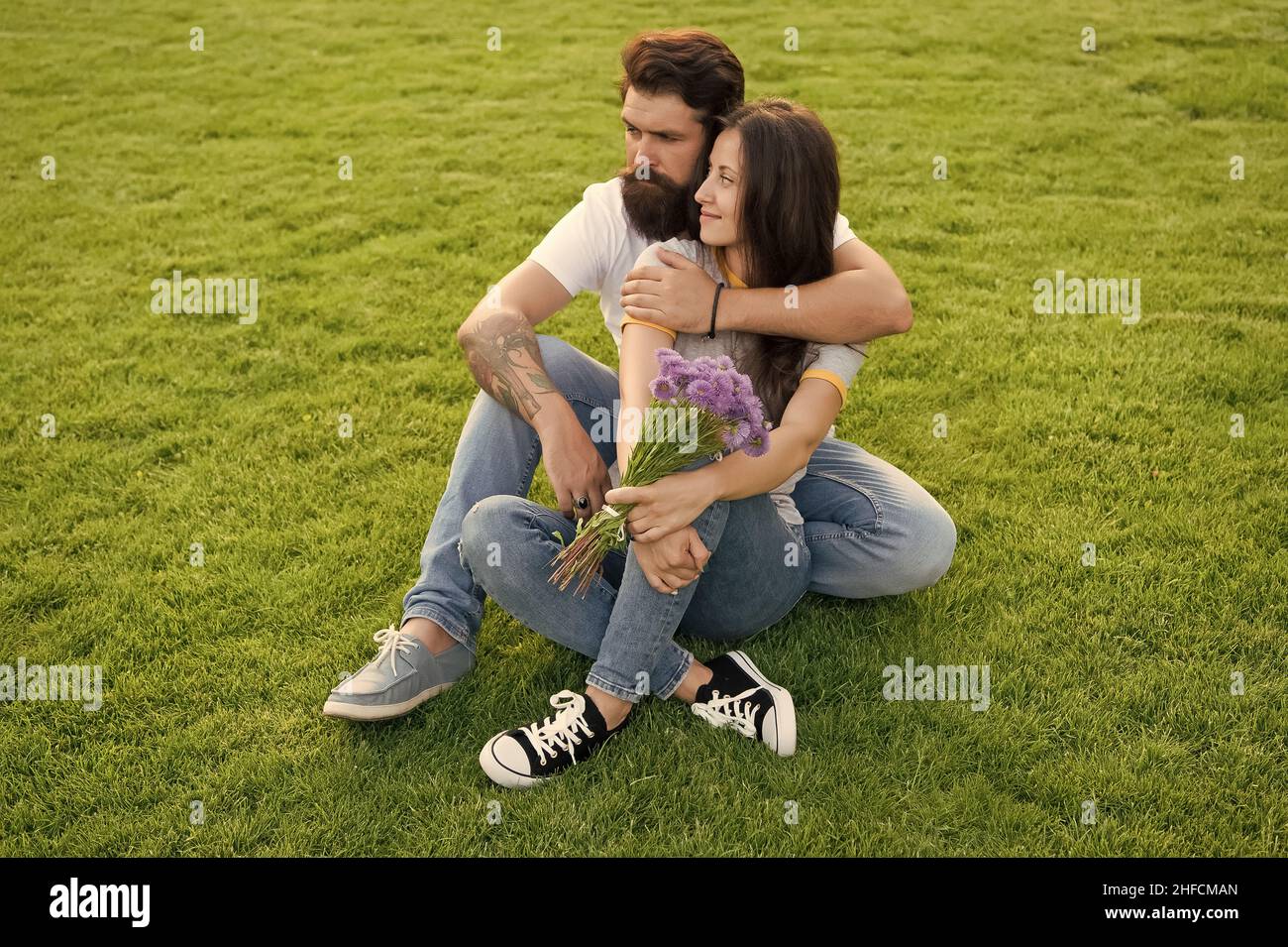 Carefree couple in love cuddling relax in park, youth day concept Stock ...