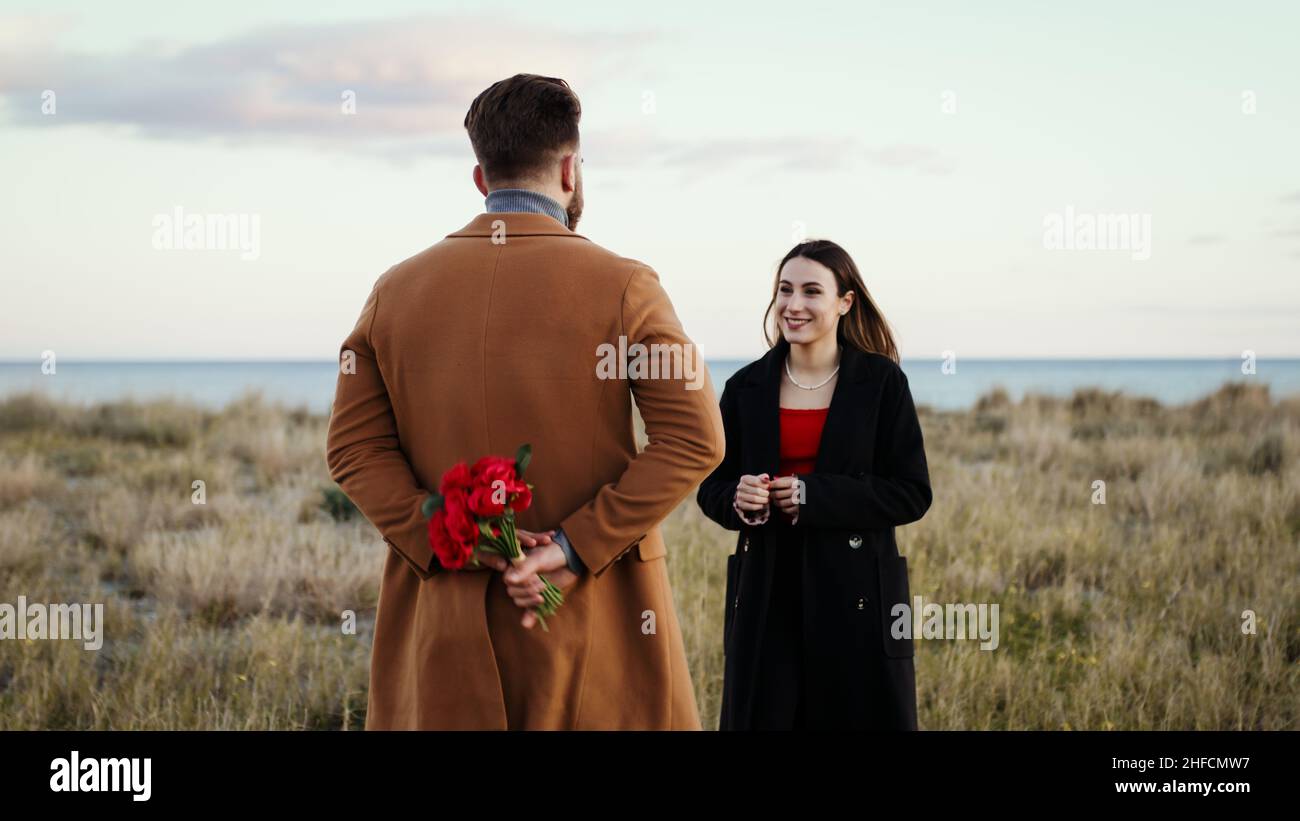 Boy Gives Red Roses To his Girlfriend Stock Photo - Alamy