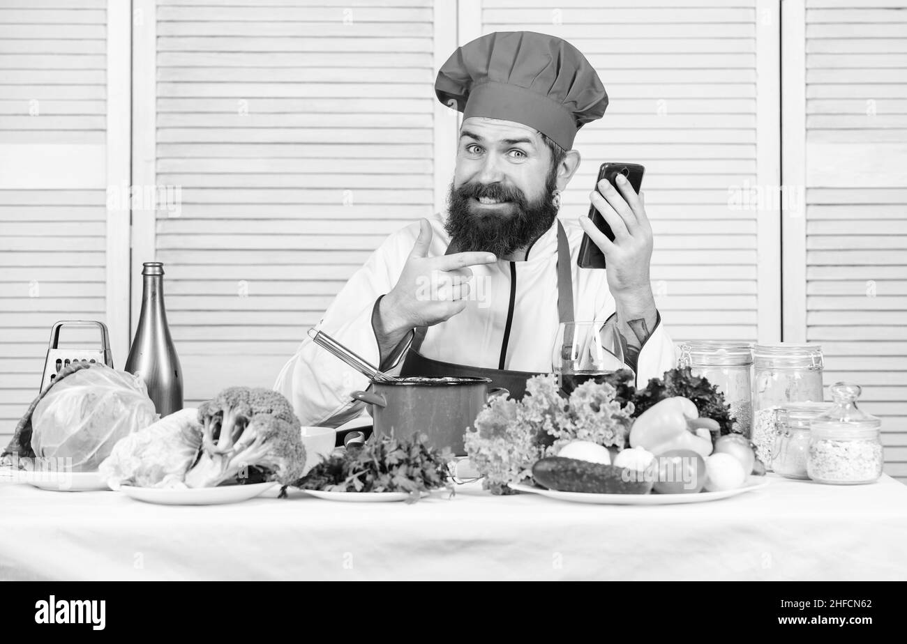 Elearning concept. Man chef searching internet recipe cooking food ...