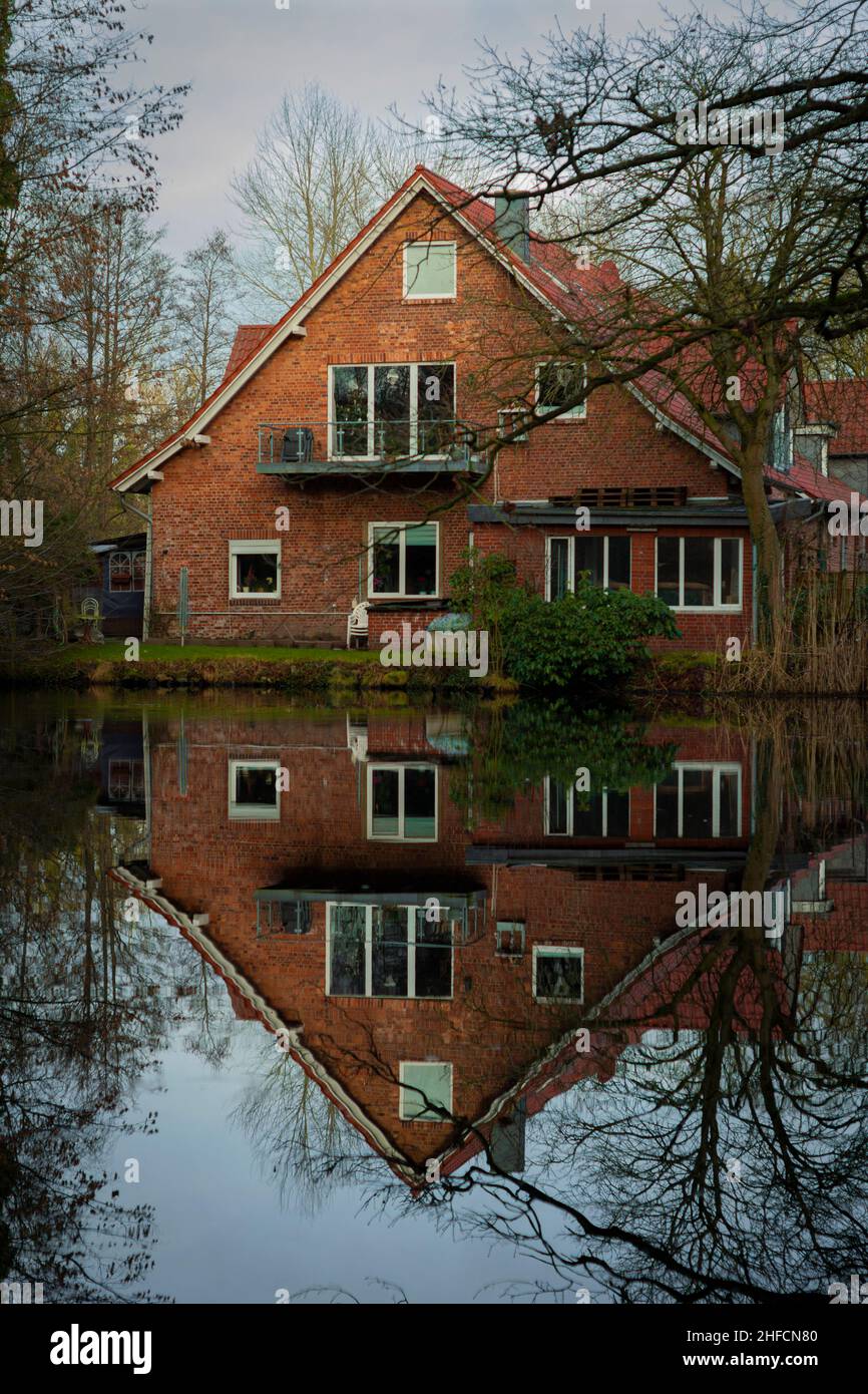 House reflection on small lake Stock Photo - Alamy