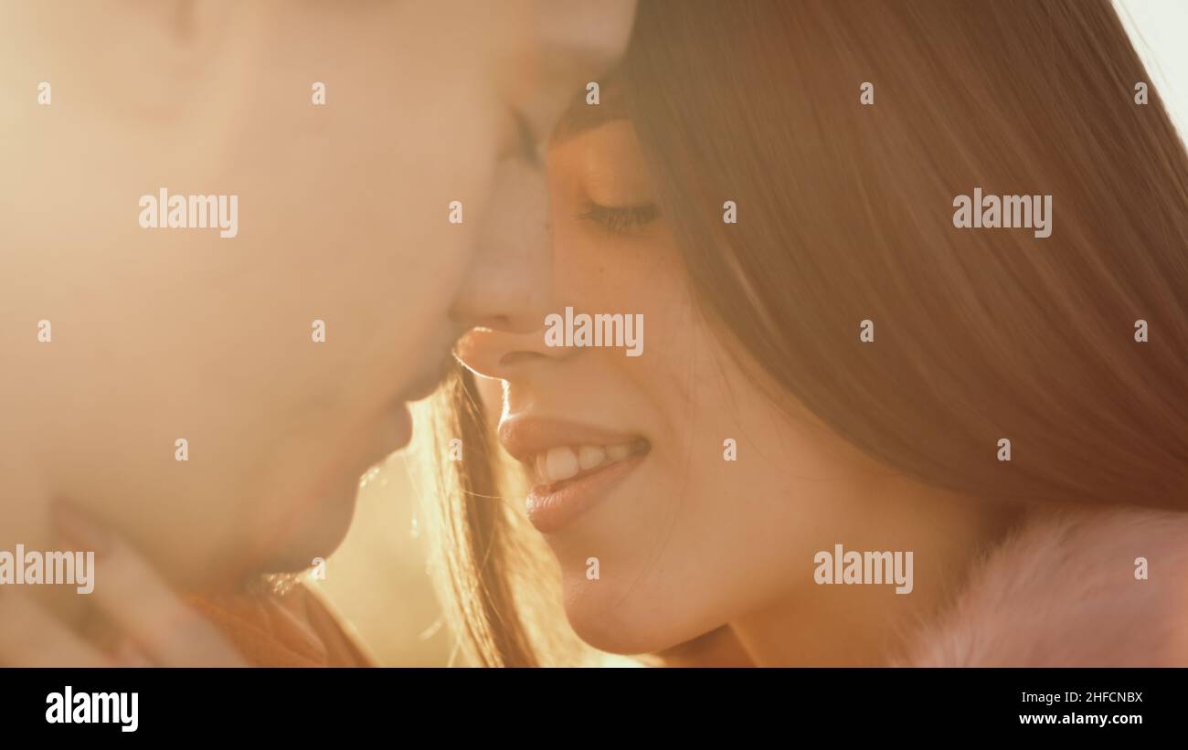 Romantic Couple look Each Other At Sunset light Stock Photo - Alamy