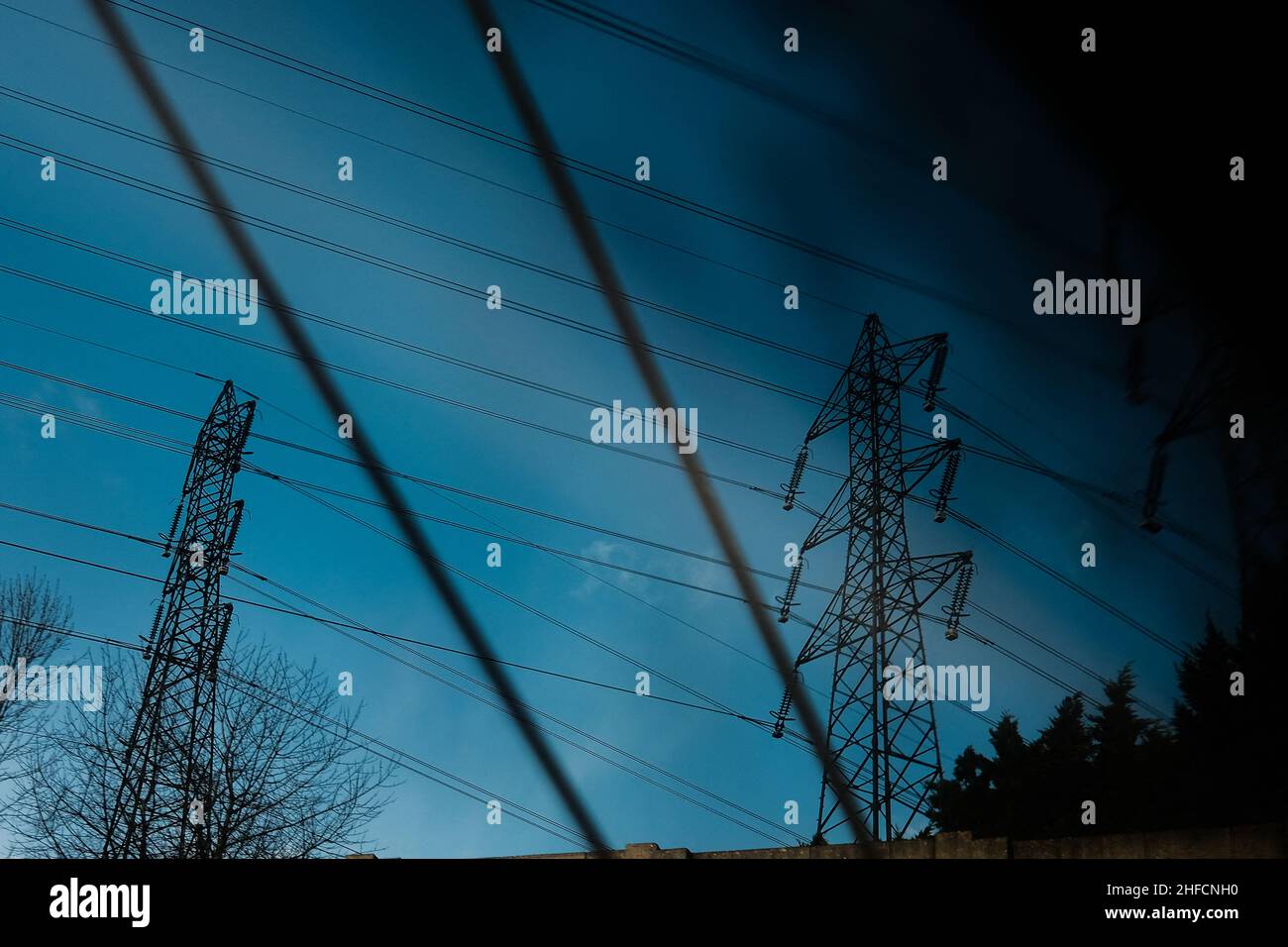 This photo shows high voltage lines, erected in the middle of farmland ...