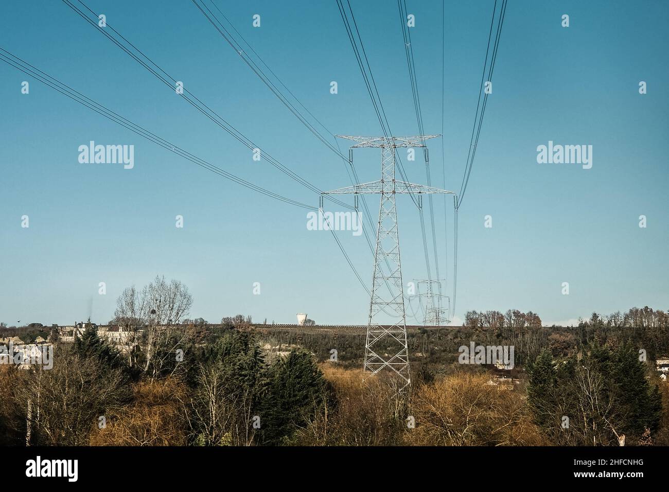 This photo shows high voltage lines, erected in the middle of farmland ...