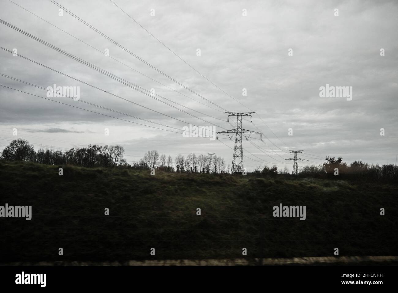 This photo shows high voltage lines, erected in the middle of farmland ...