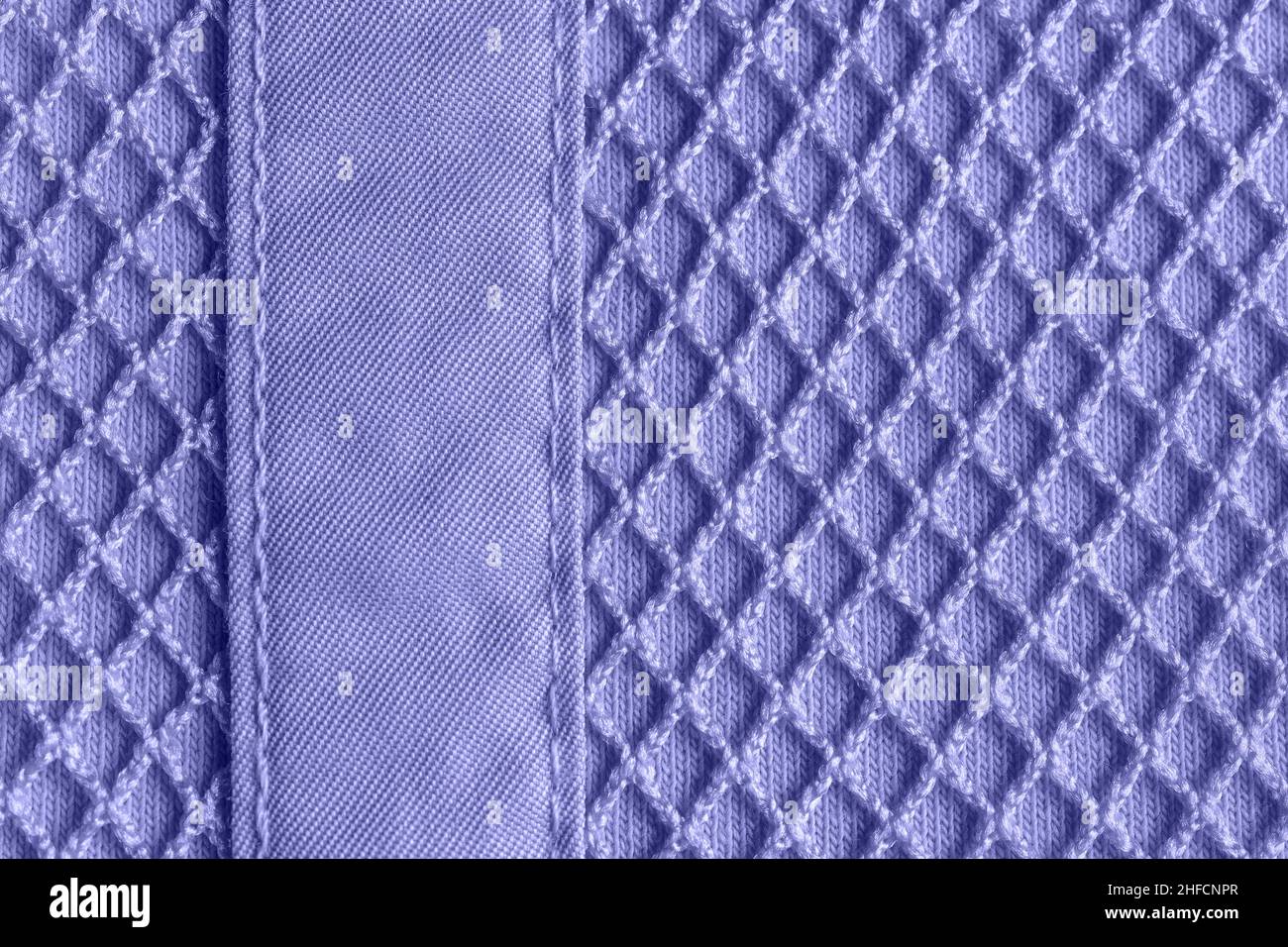 Background of textile mesh over cotton jersey. Macro. Texture of blue ...