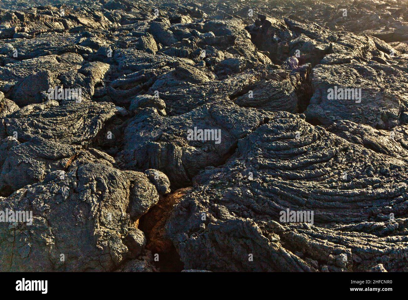 Stones of volcanic flow give a beautiful natural structure Stock Photo ...