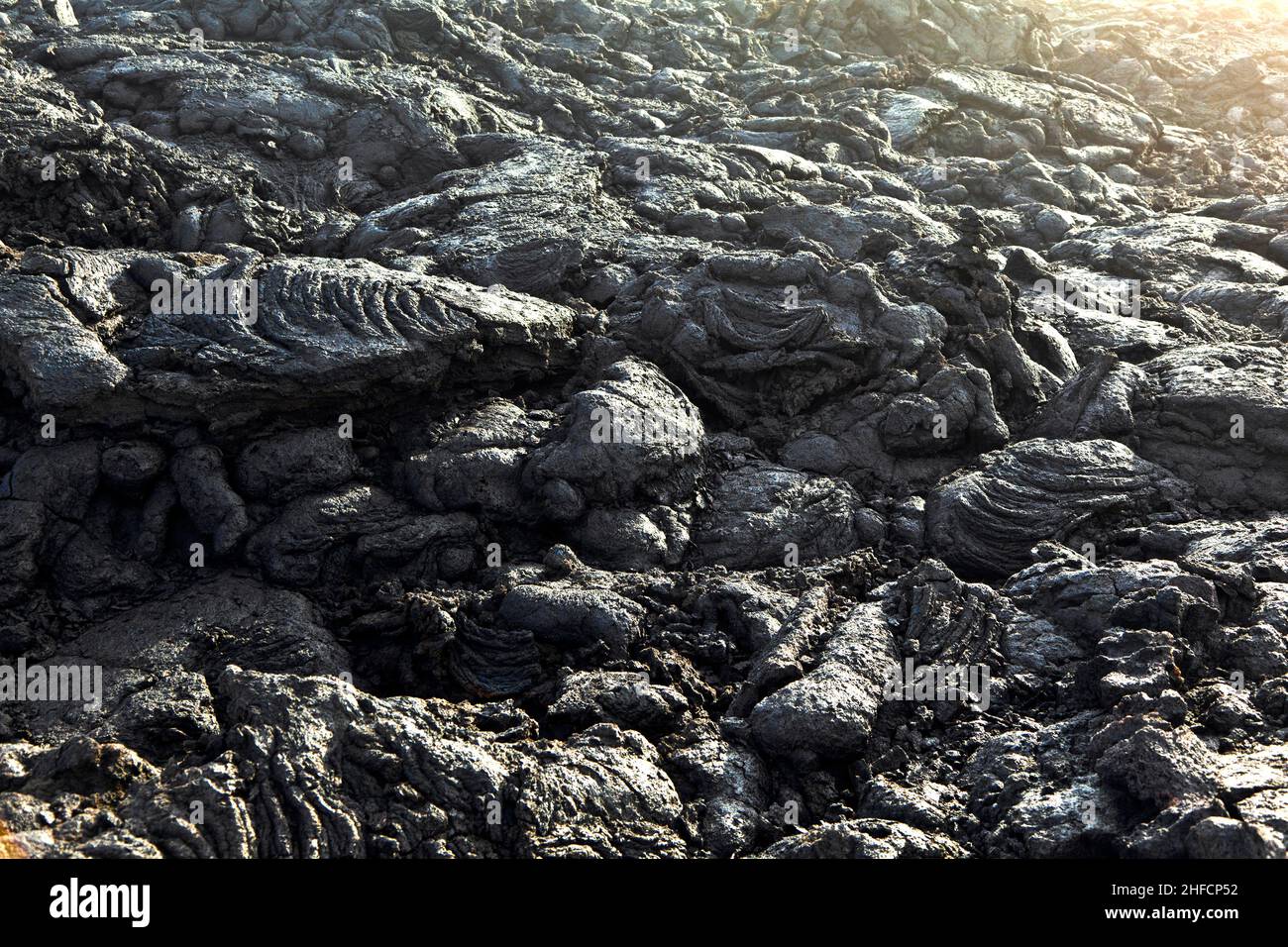 Stones of volcanic flow give a beautiful natural structure Stock Photo ...