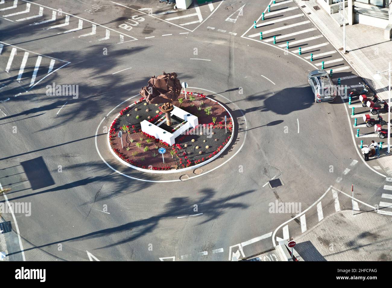 roundabout with sculpture of old cars Stock Photo - Alamy