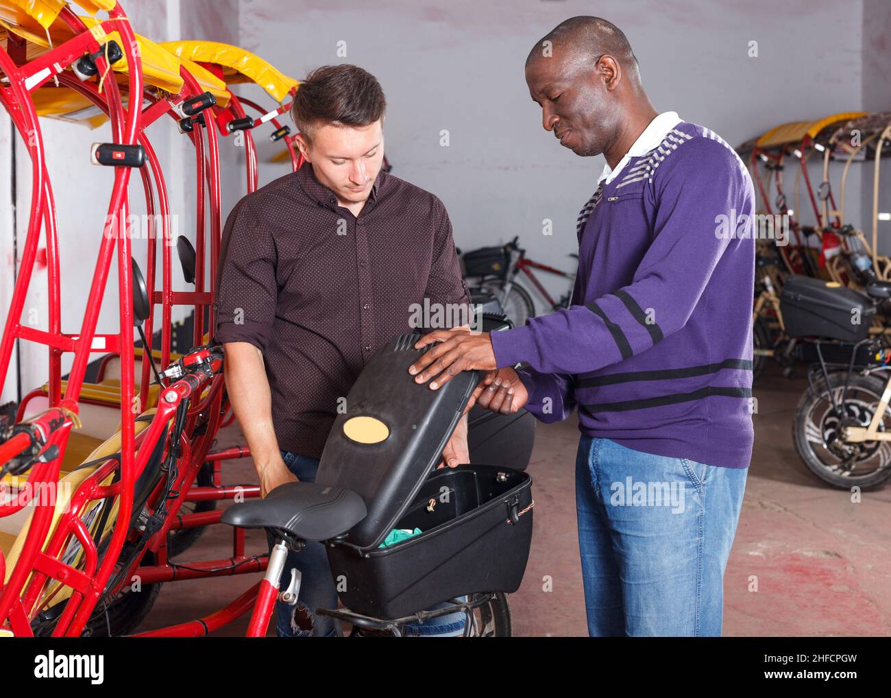 Guy planning to hire velotaxi Stock Photo - Alamy