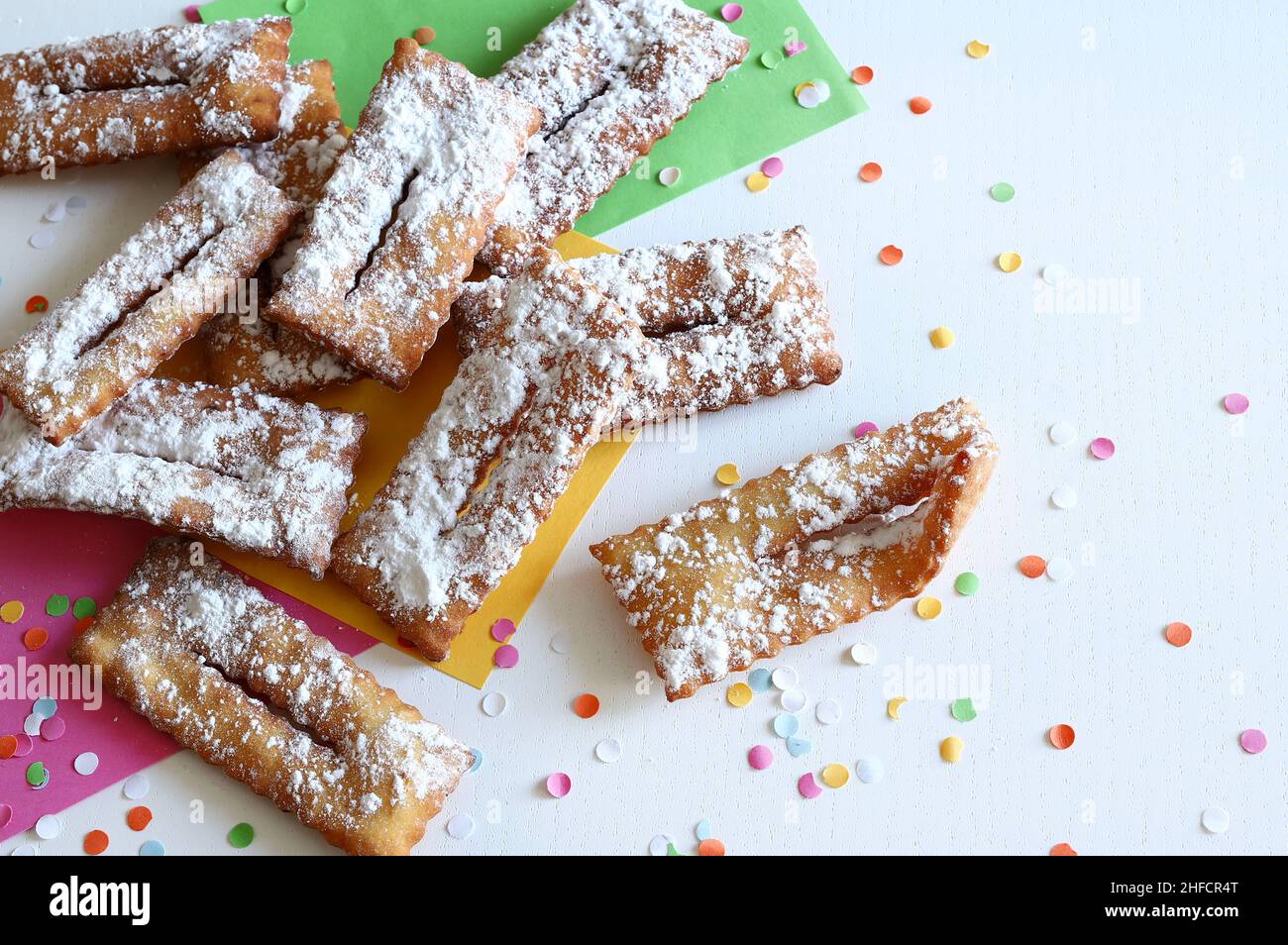 Homemade traditional Italian carnival sweets: chiacchiere on white ...