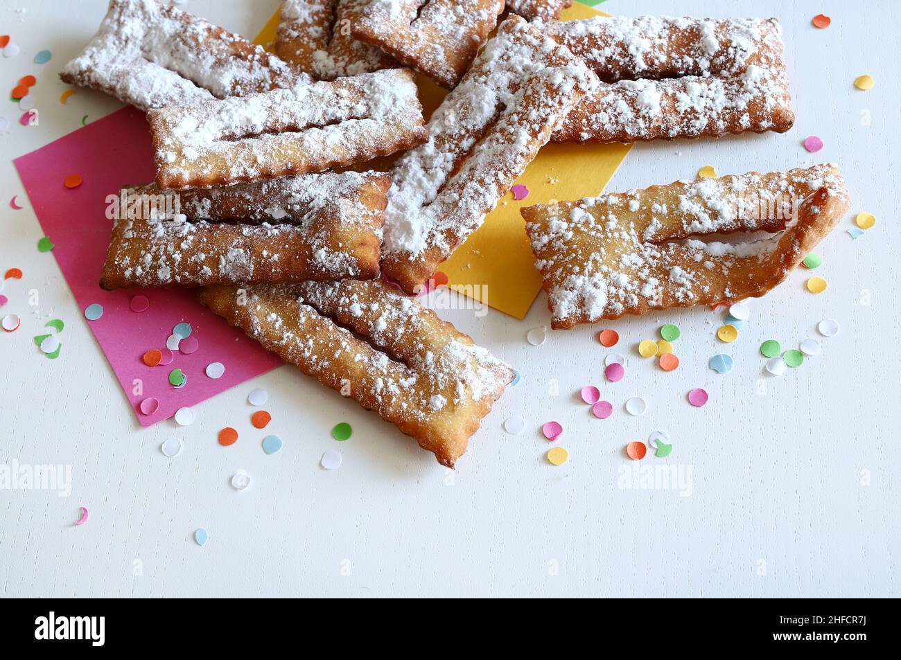 Homemade traditional Italian carnival sweets: chiacchiere on white ...