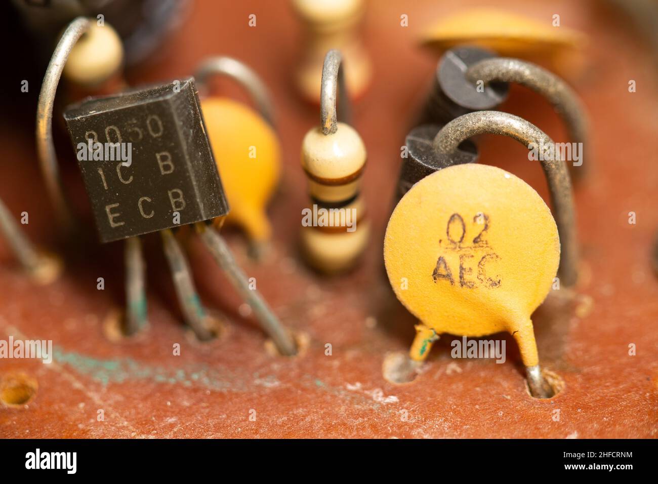 Old circuit board with electronic components such as transistor and ...