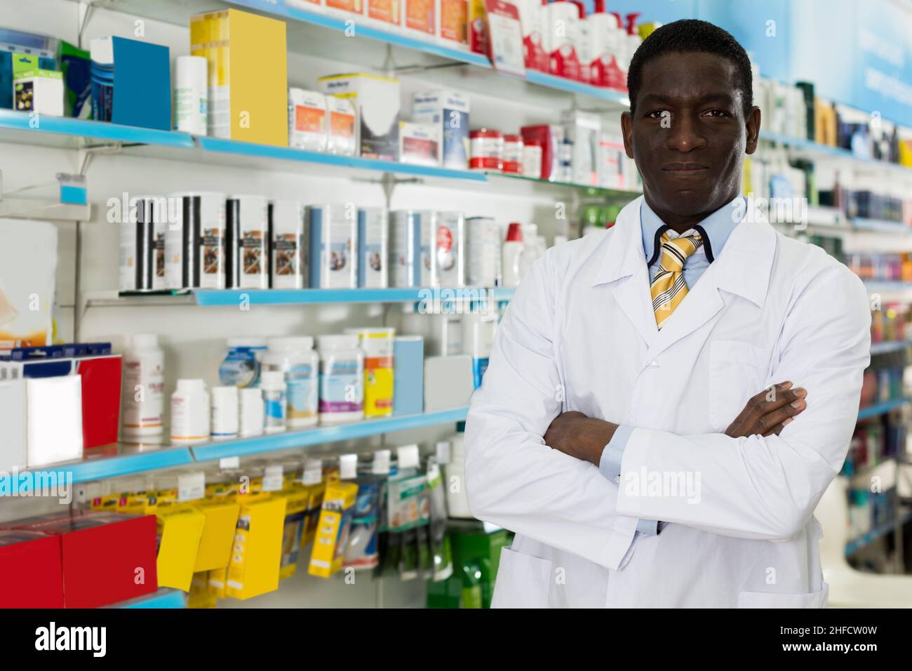 man pharmacist standing in interior of pharmacy Stock Photo - Alamy