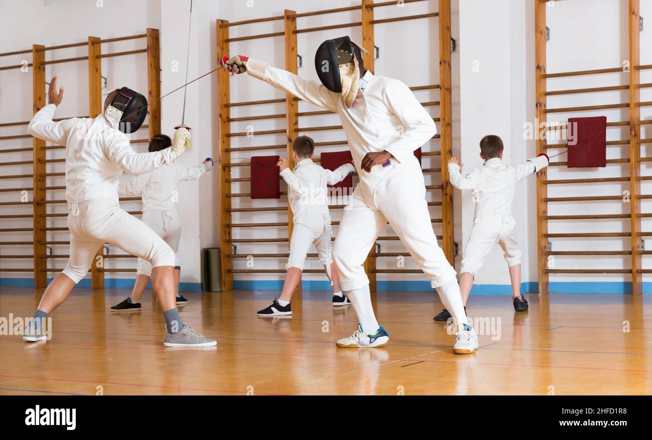 fencers trains in pairs Stock Photo - Alamy