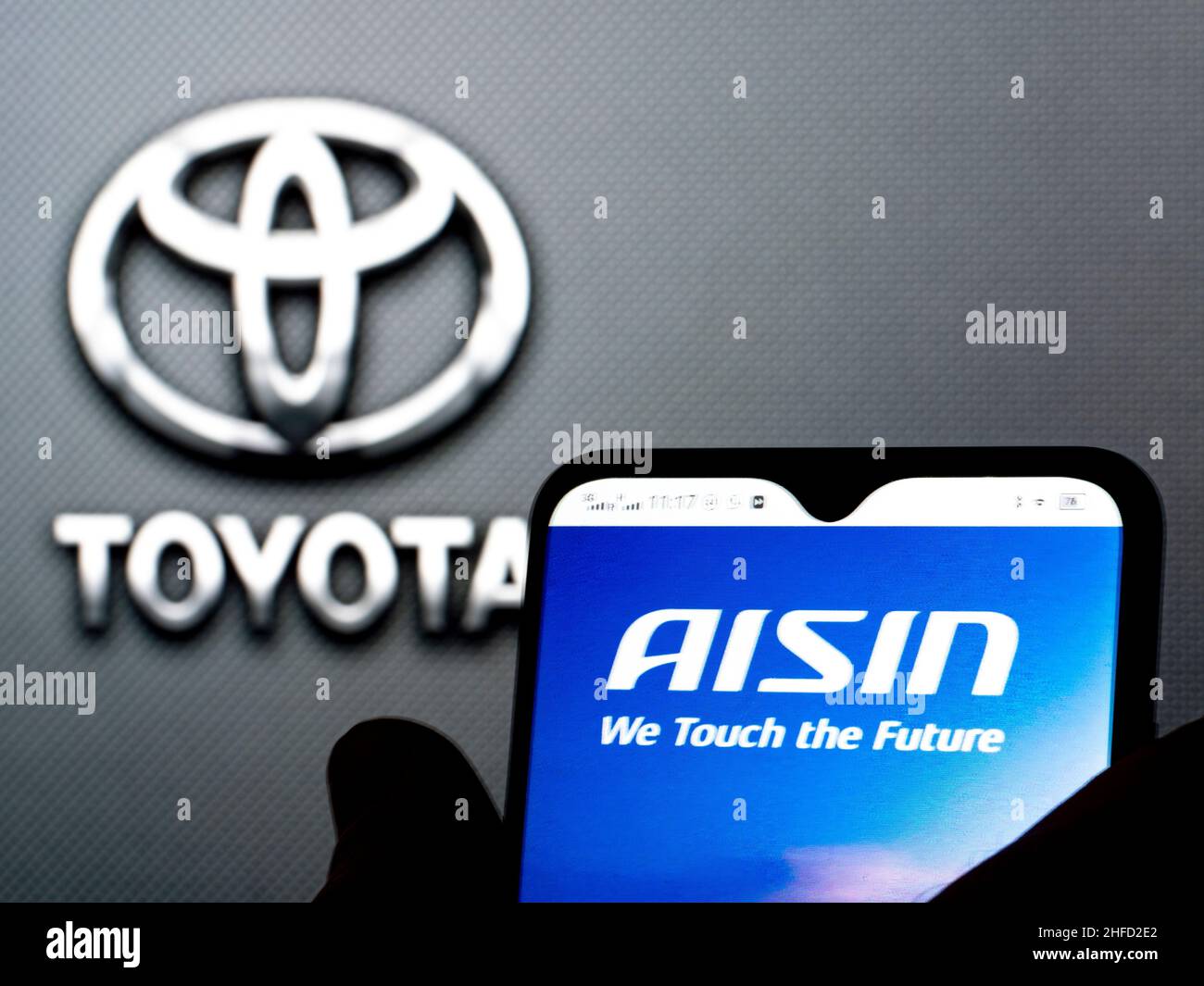 In this photo illustration, the AISIN Corporation part by Toyota Group ...