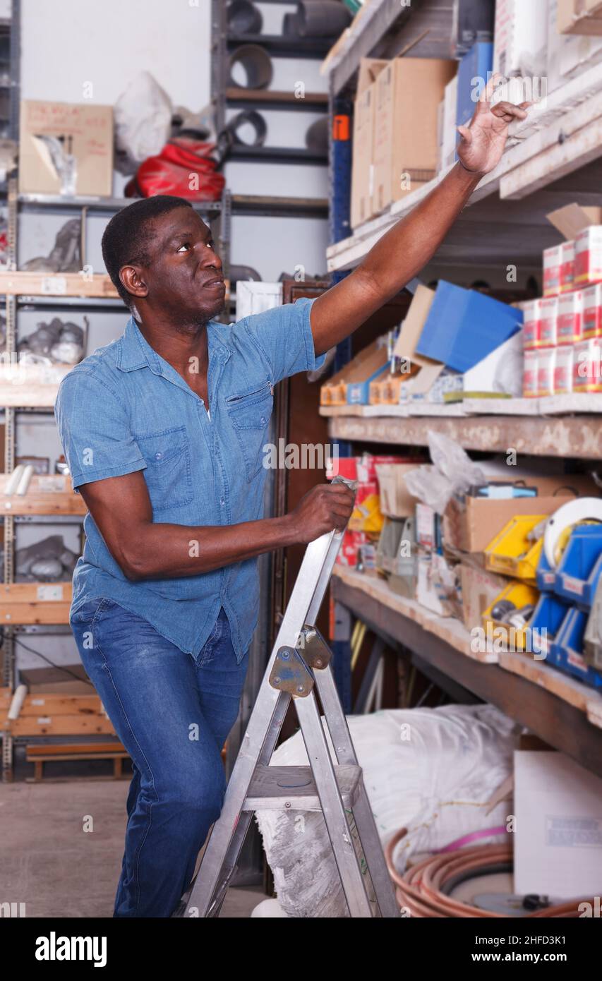 Man choosing building materials in shop Stock Photo - Alamy