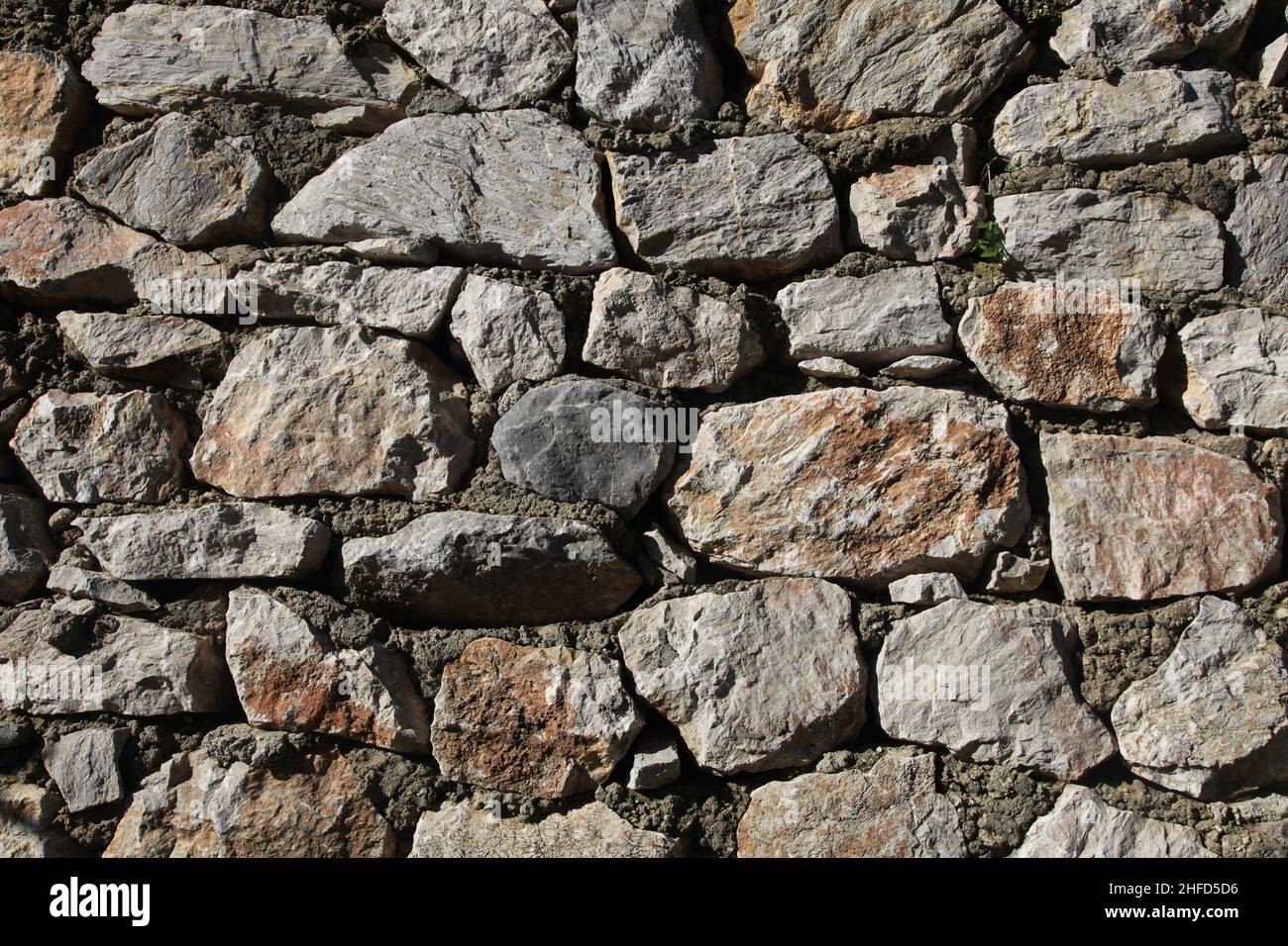 Stonewall. A stone wall made using concrete. Close up the background ...