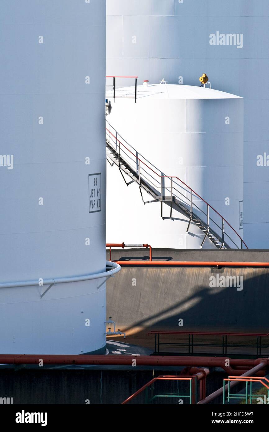 white tanks in tank farm with iron staircase Stock Photo - Alamy