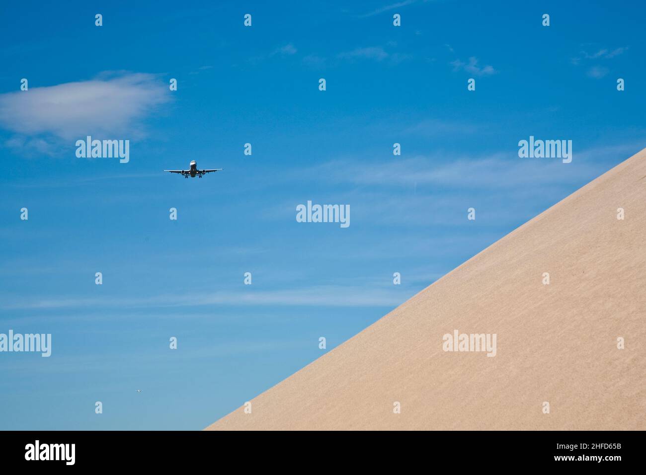 gravel pit hill with approaching aircraft Stock Photo - Alamy