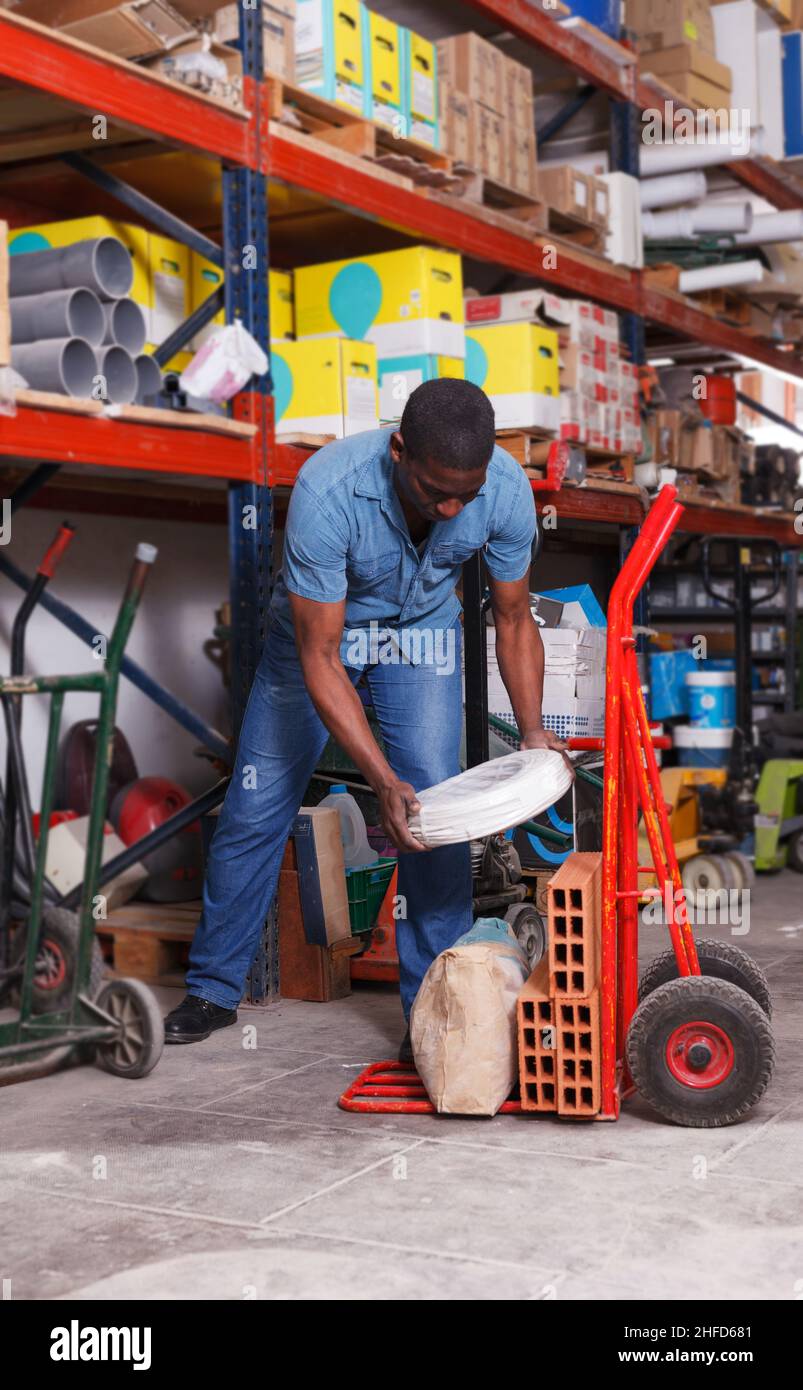 Man loading materials hi-res stock photography and images - Alamy