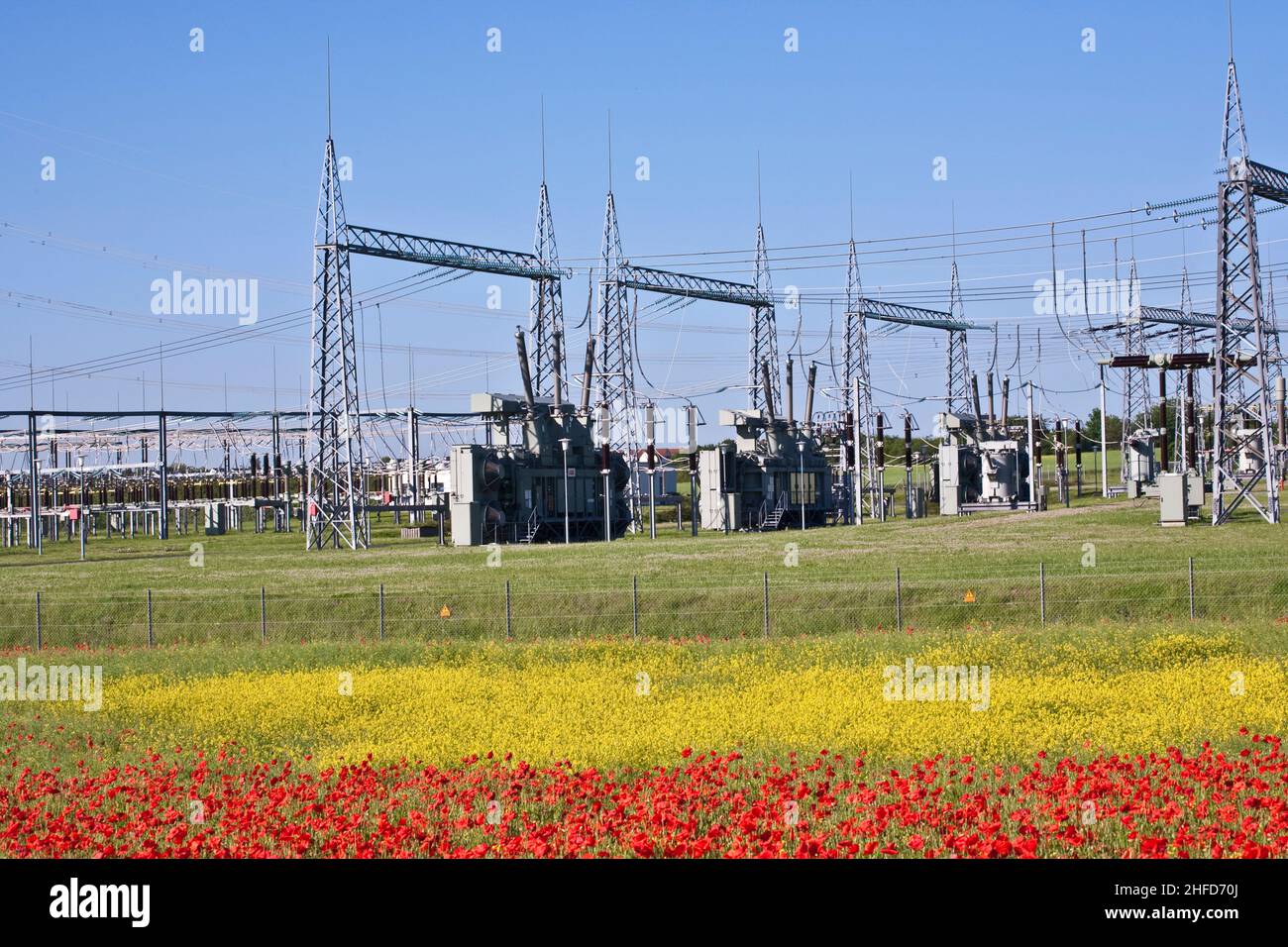 electrical power plant in beautiful colorful meadow Stock Photo - Alamy