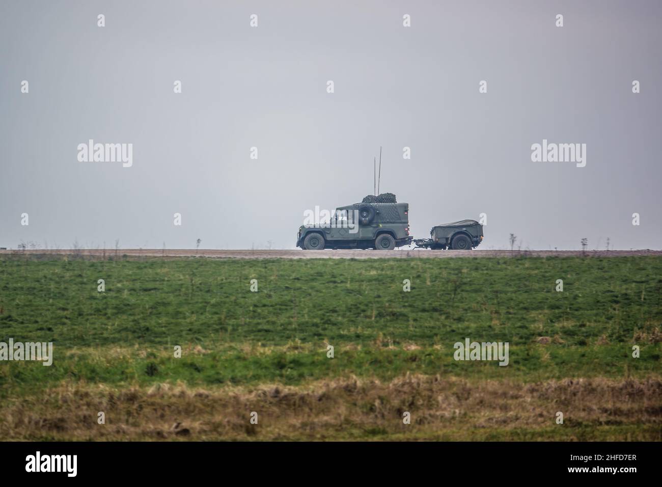british army land rover defender 110 wolf 4x4 in action on a military ...