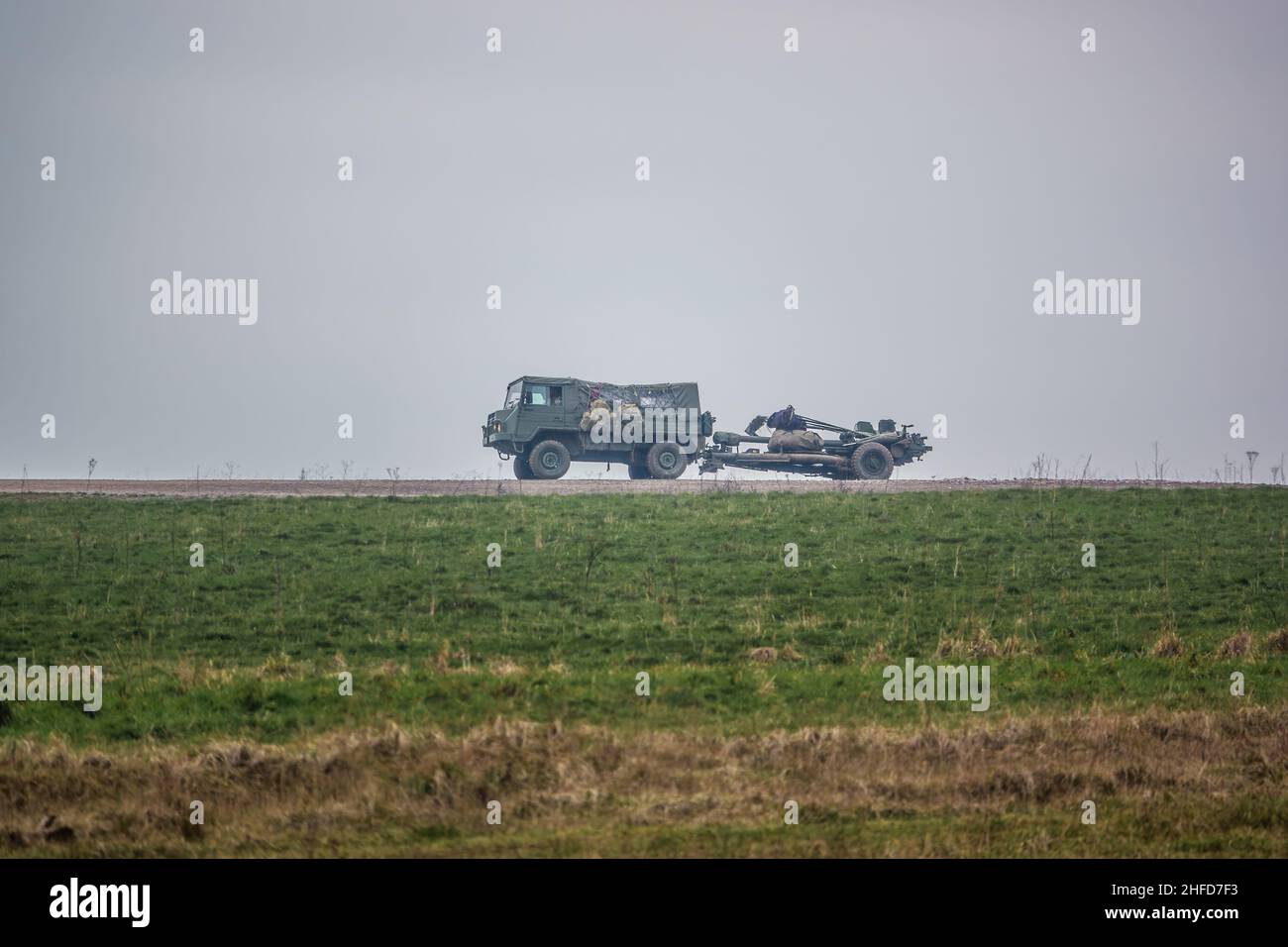 British army Pinzgauer High-Mobility All-Terrain 4x4 vehicle towing a ...