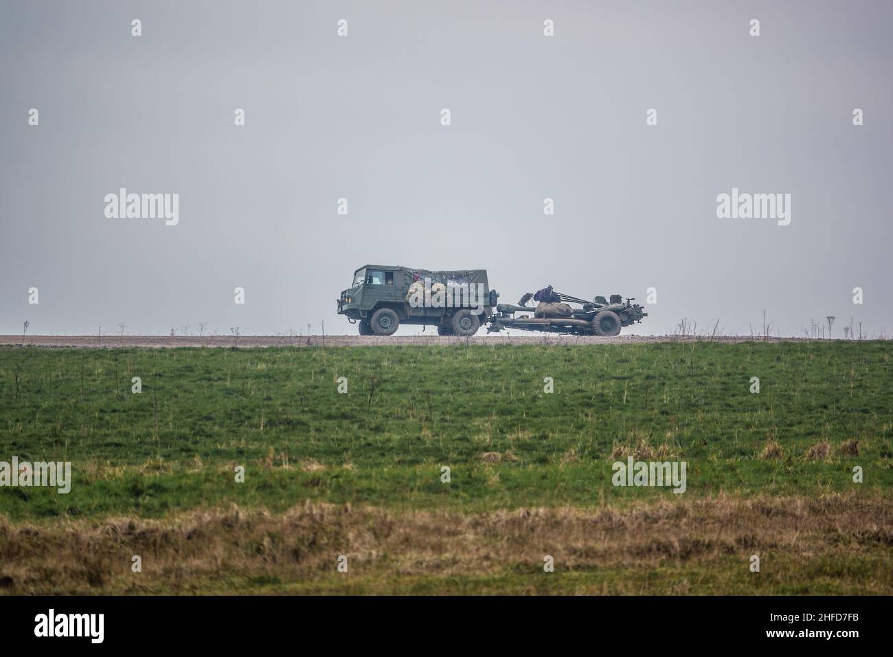 British army Pinzgauer High-Mobility All-Terrain 4x4 vehicle towing a ...