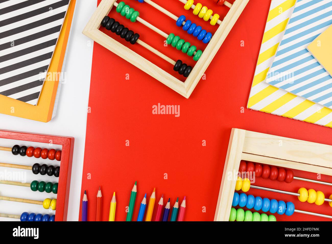 Multicolored wooden blocks on red background. Trendy puzzle toys ...