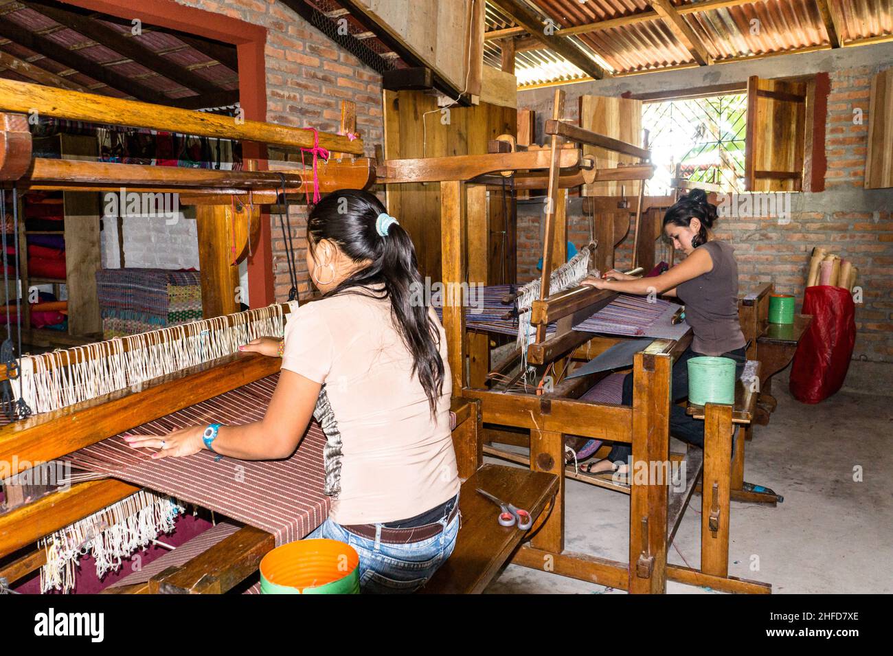 Two weavers on Glimakra floor looms produced yardage for crafts Stock ...