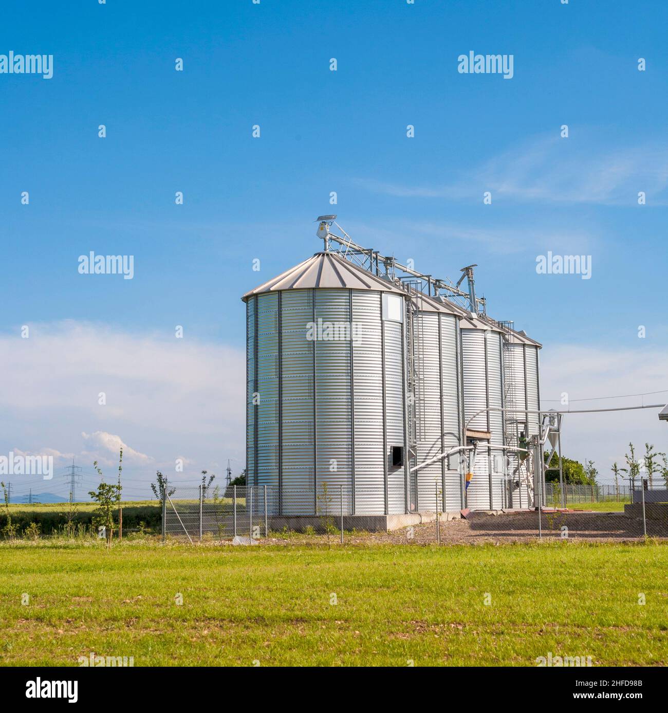 beautiful silver silos in landscape Stock Photo - Alamy