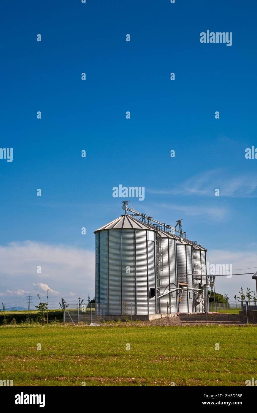 beautiful silver silos in landscape Stock Photo - Alamy