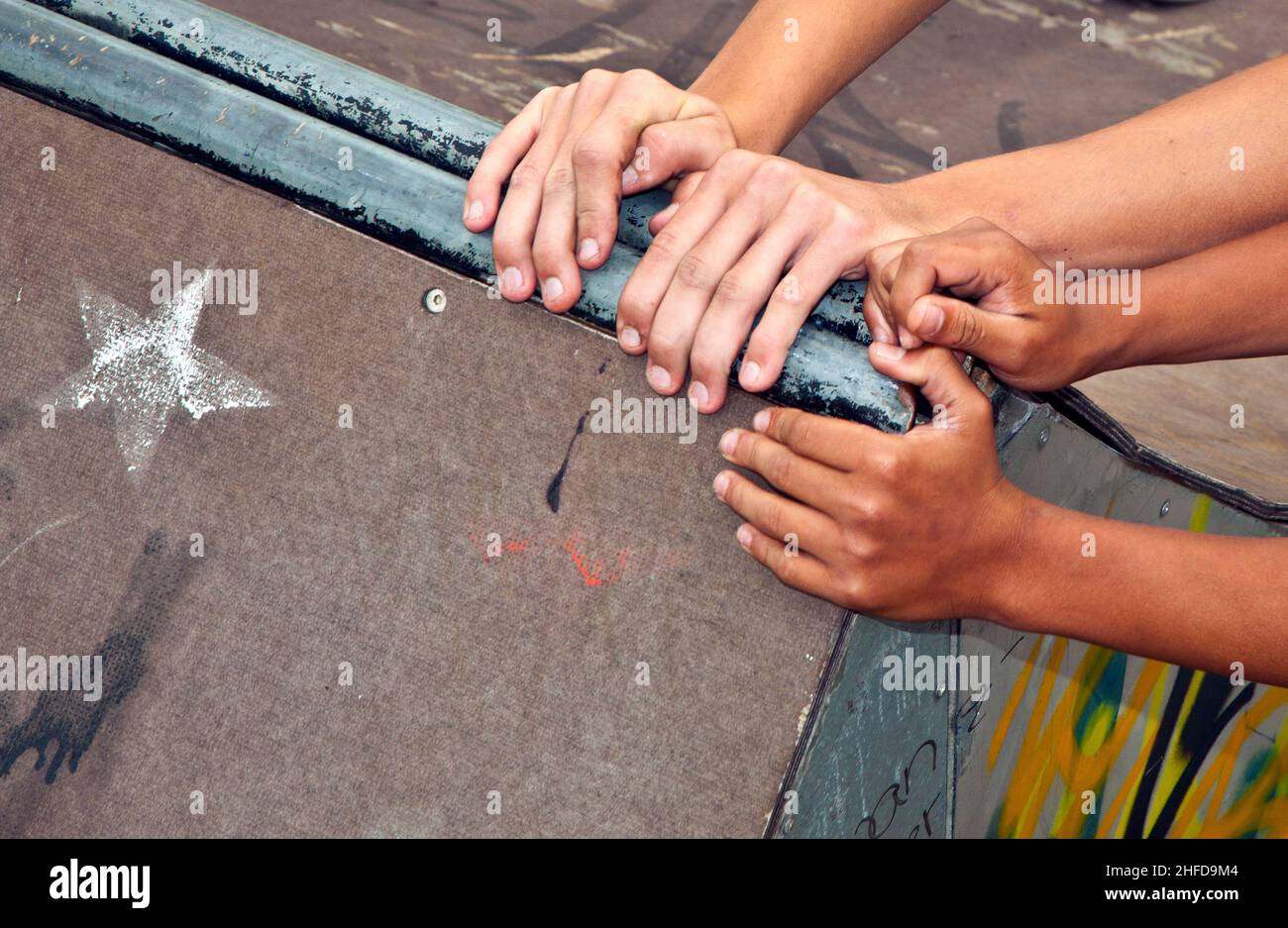 boys are pushing a ramp with hands to another place Stock Photo - Alamy