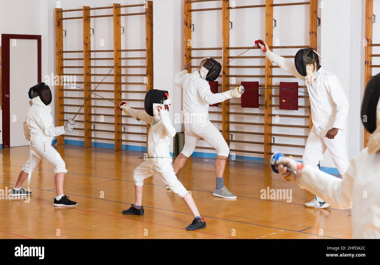 Young fencers training with coach Stock Photo - Alamy