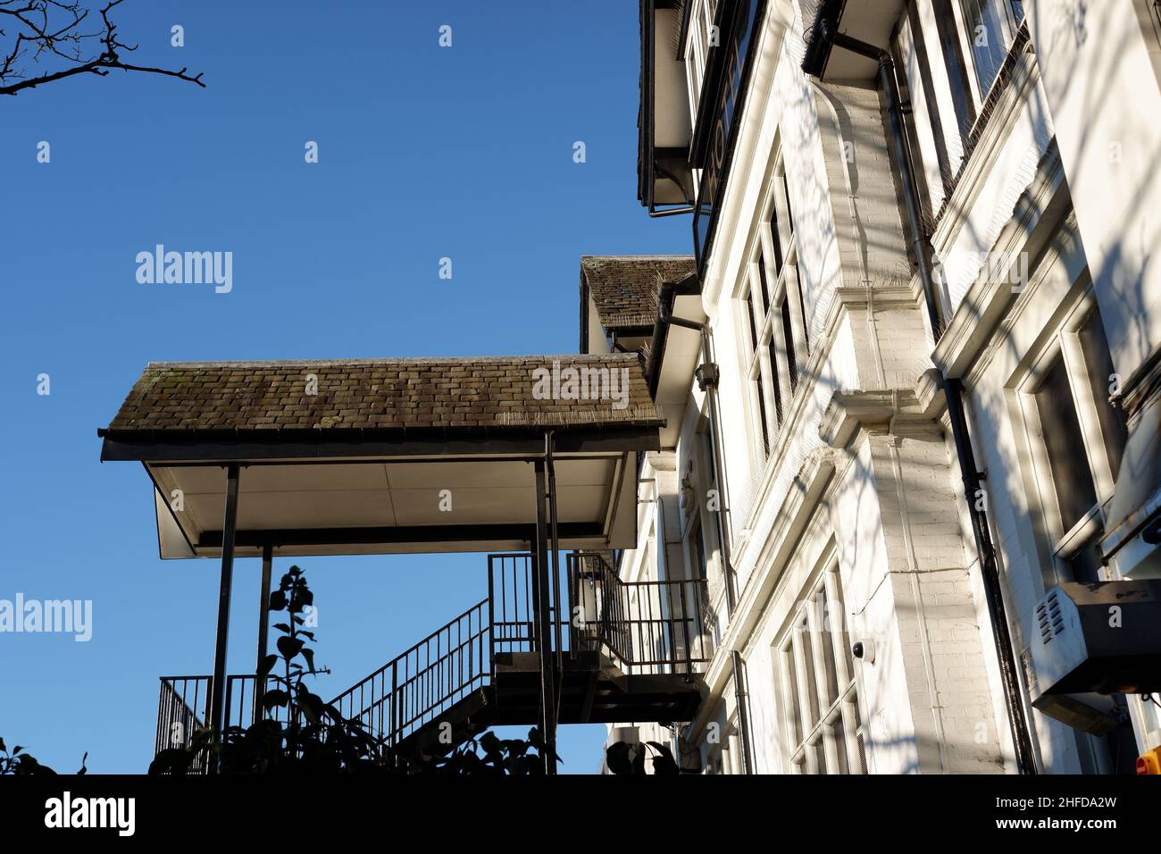 Old hotel building with covered entrance Stock Photo - Alamy