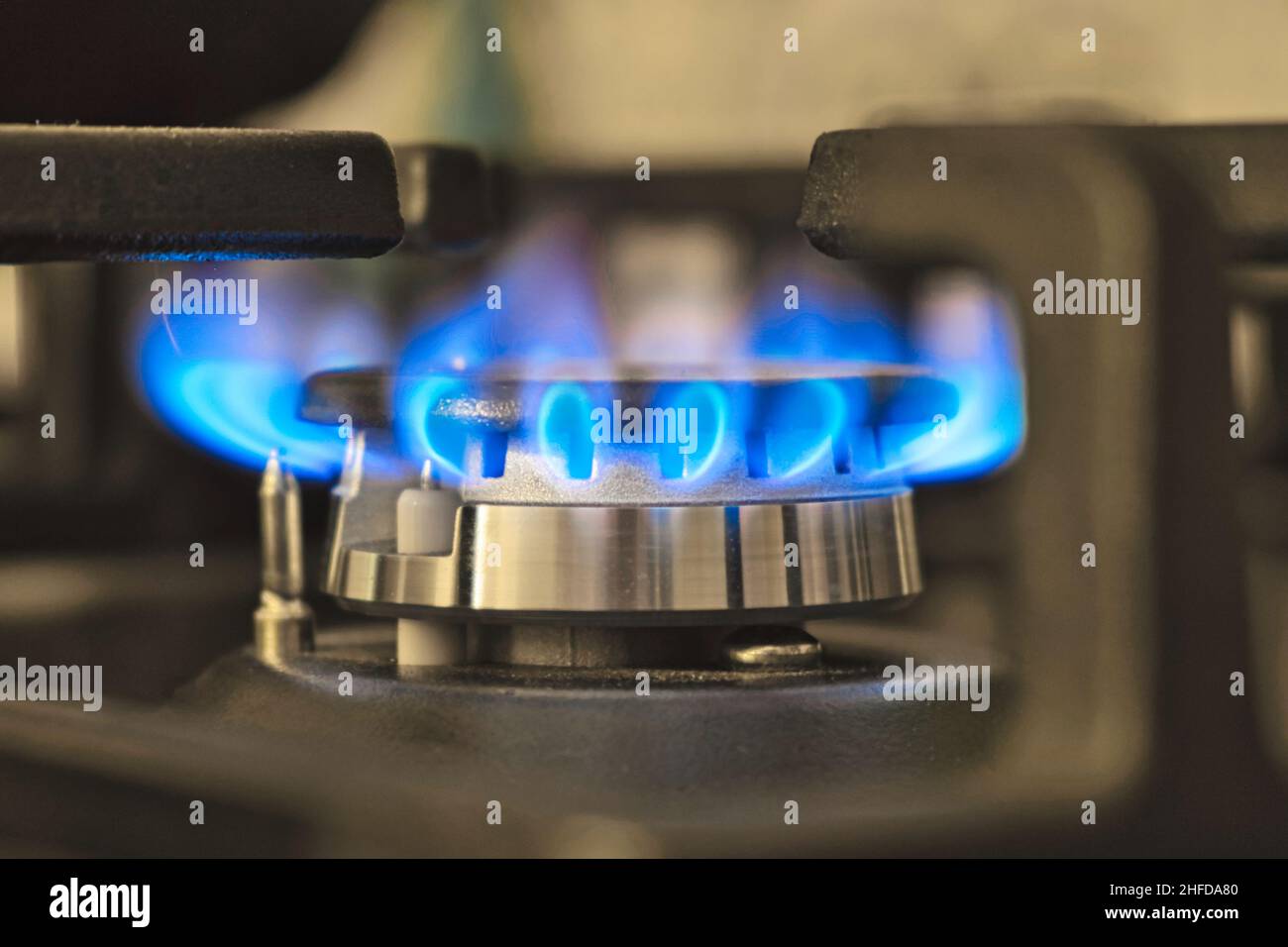 Natural gas burning by blue flames in kitchen stove. Food cooking at ...