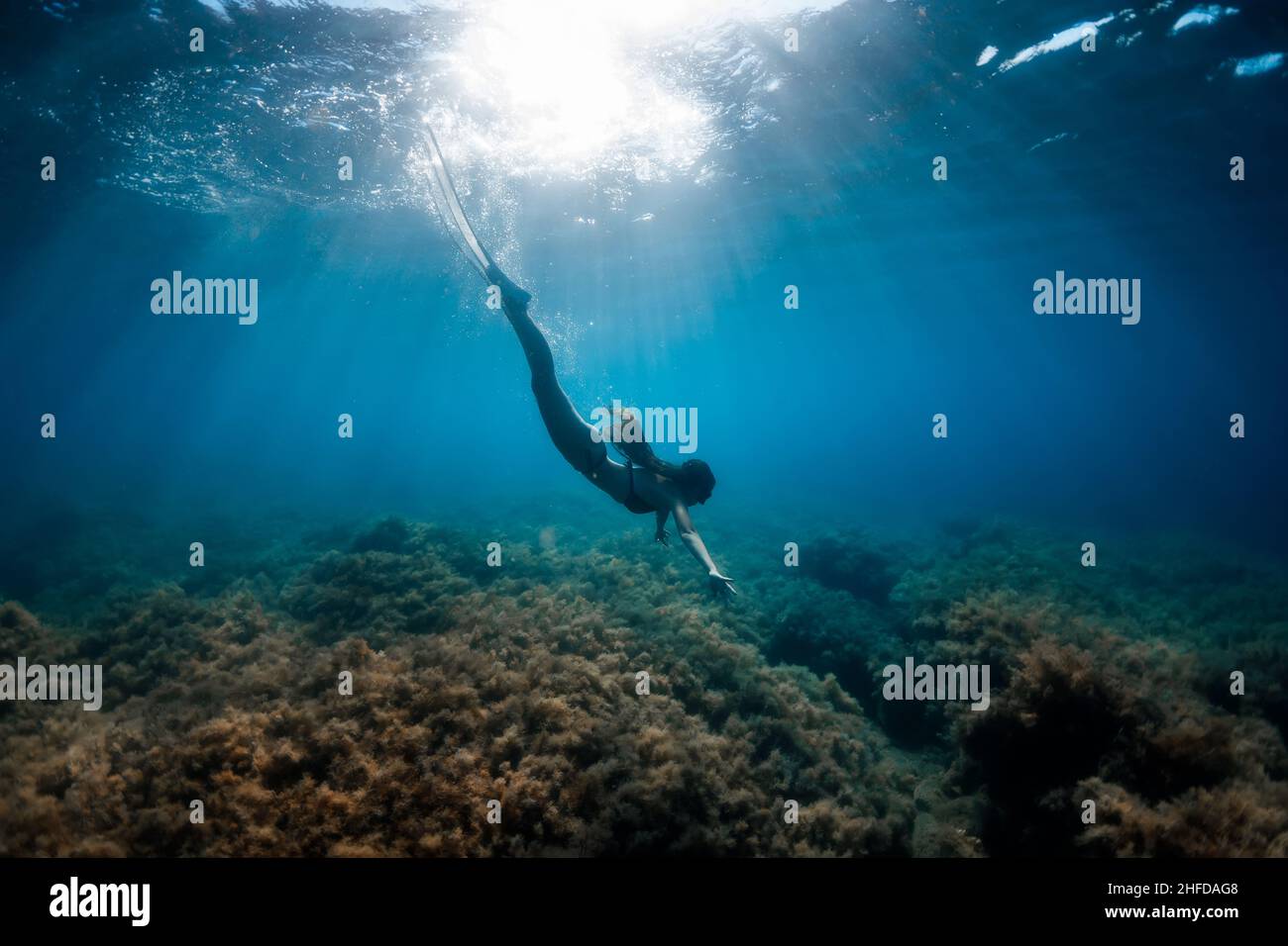 Young woman dive rocks hi-res stock photography and images - Alamy