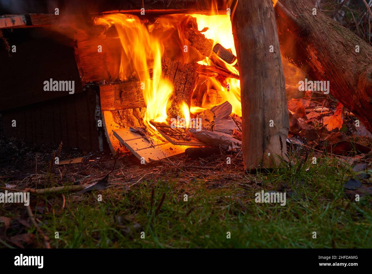 Logs on a garden bonfire Stock Photo - Alamy