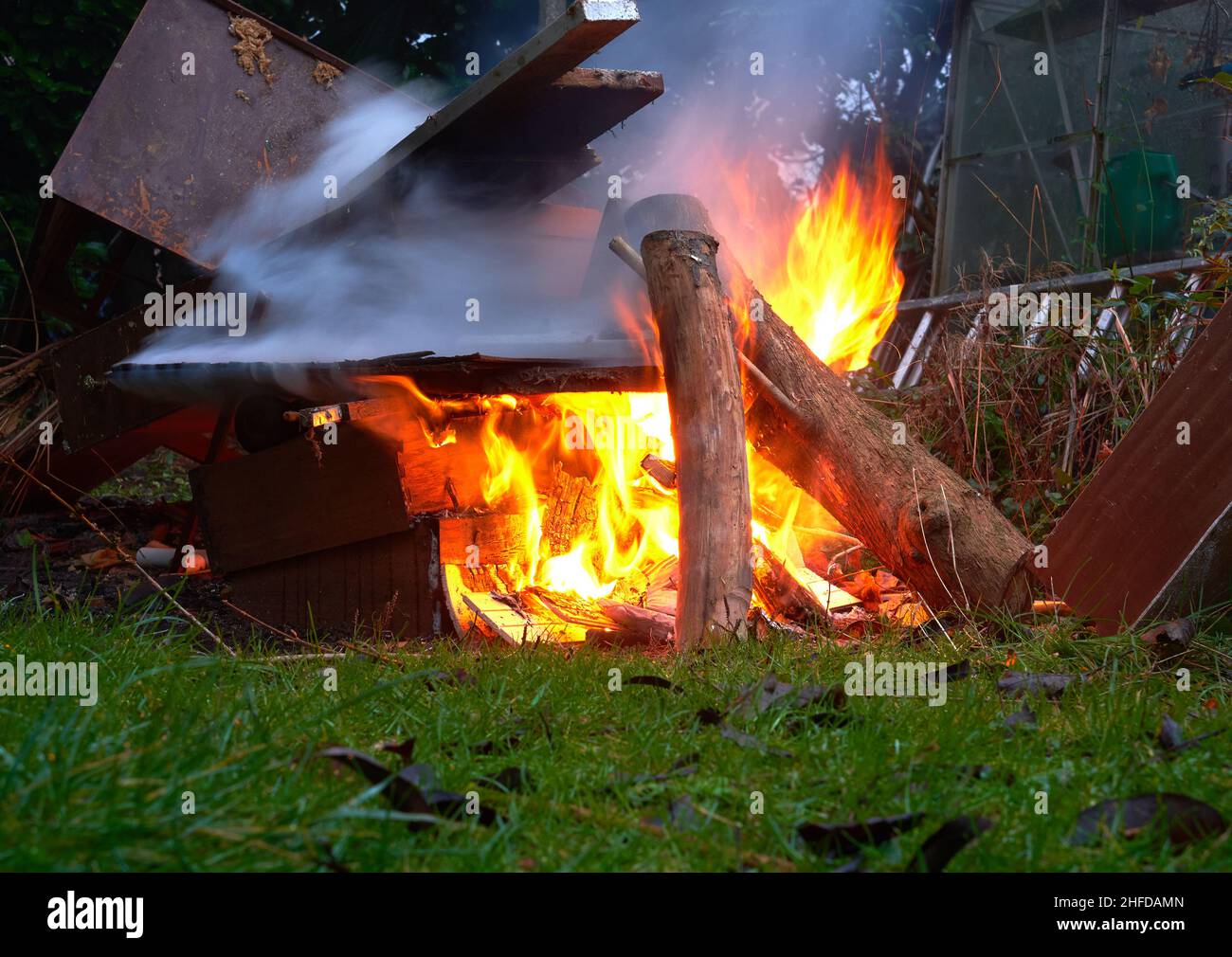 Logs on a garden bonfire Stock Photo - Alamy