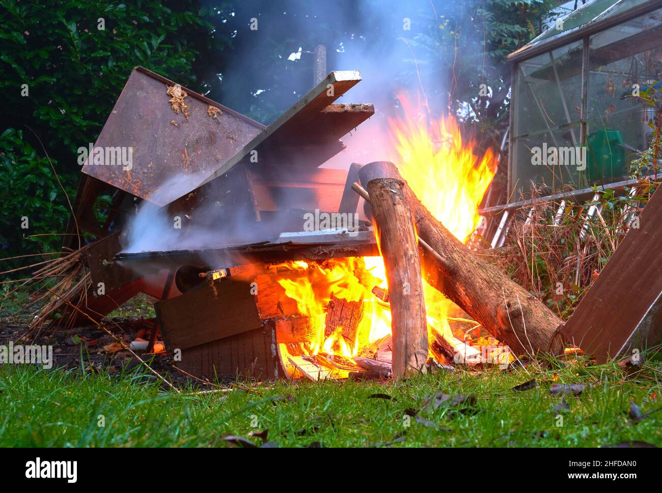 Logs on a garden bonfire Stock Photo - Alamy