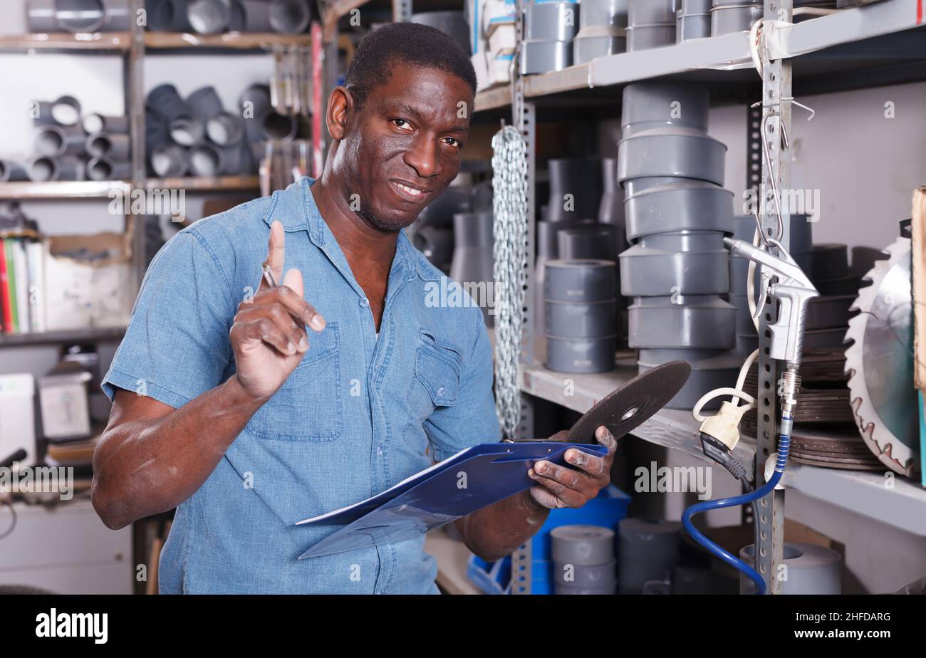 African American male making inventory Stock Photo - Alamy